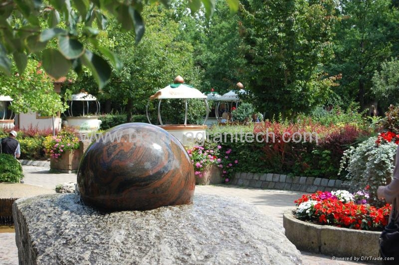 Red ,black,yellow,green,white rotating stone sphere fountains - Red ...